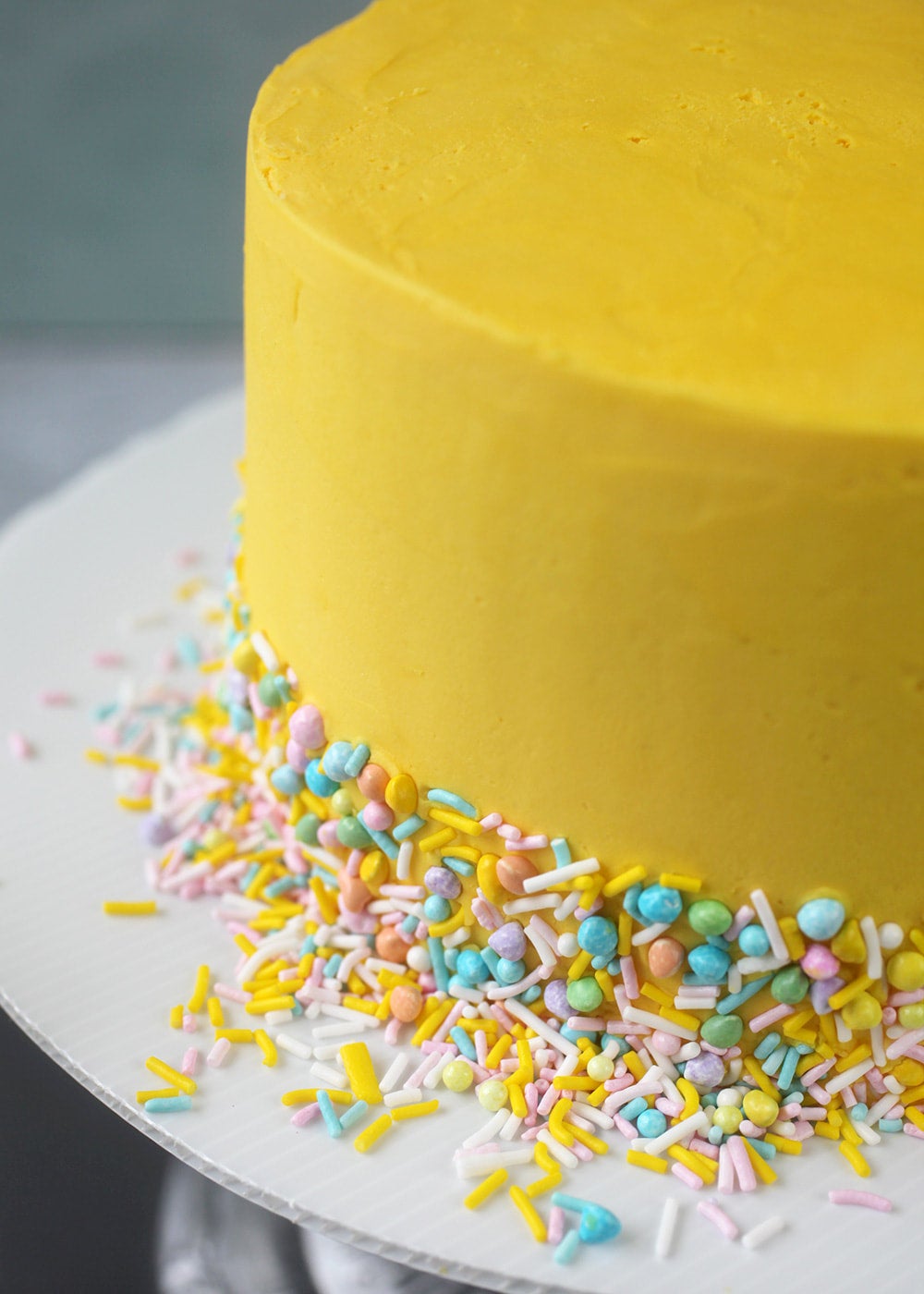 10" GF vanilla birthday cake (yellow frosting, white writing) | Sweet Avenue Bake Shop